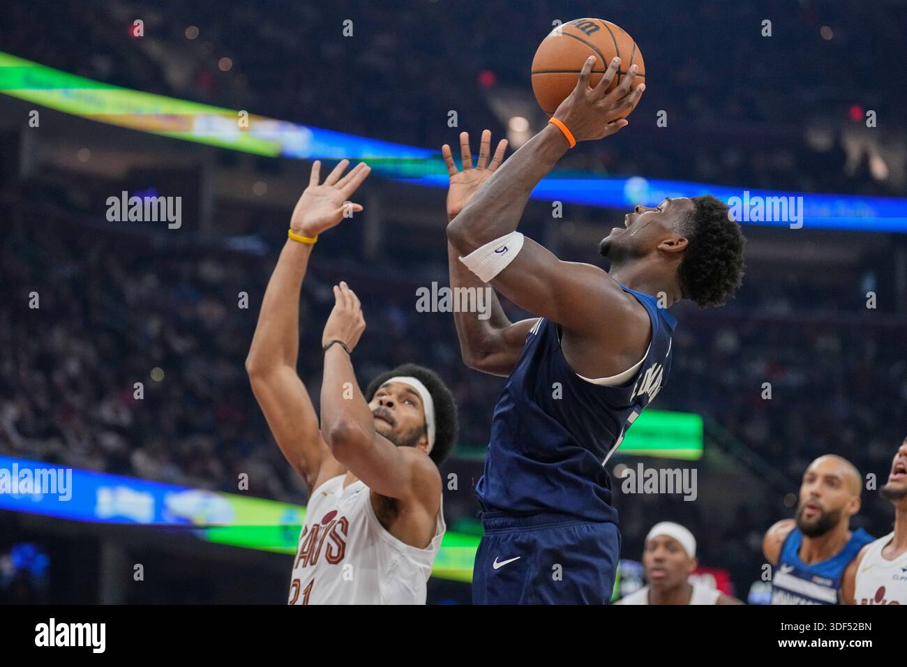 Minnesota Timberwolves guard Anthony Edwards, right, shoots next to ...