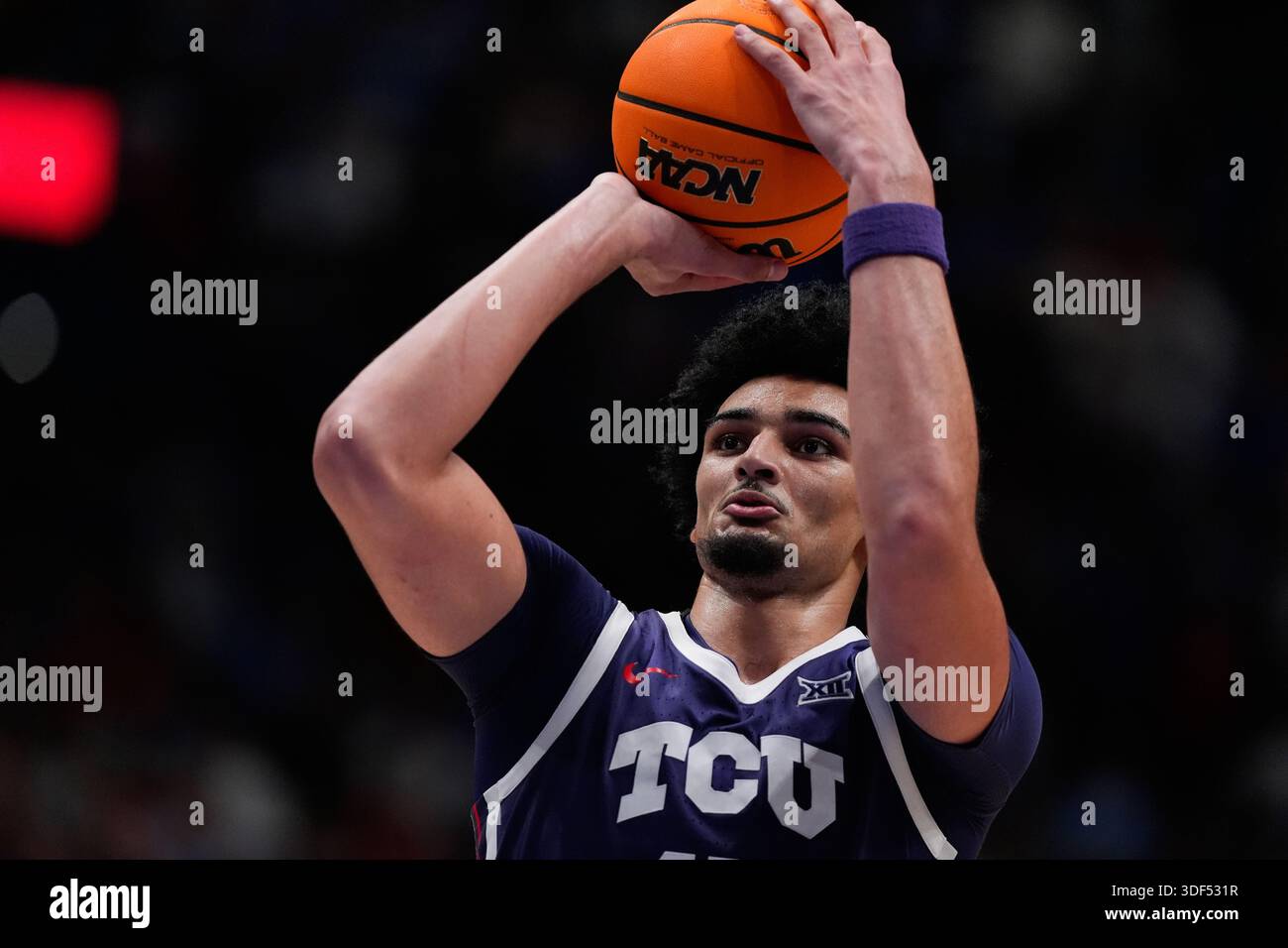 TCU forward David Punch shoots during overtime of an NCAA college ...