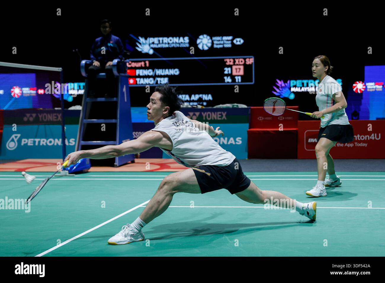 Tang Chun Man (L) and Tse Ying Suet of Hong Kong play against Feng Yan ...