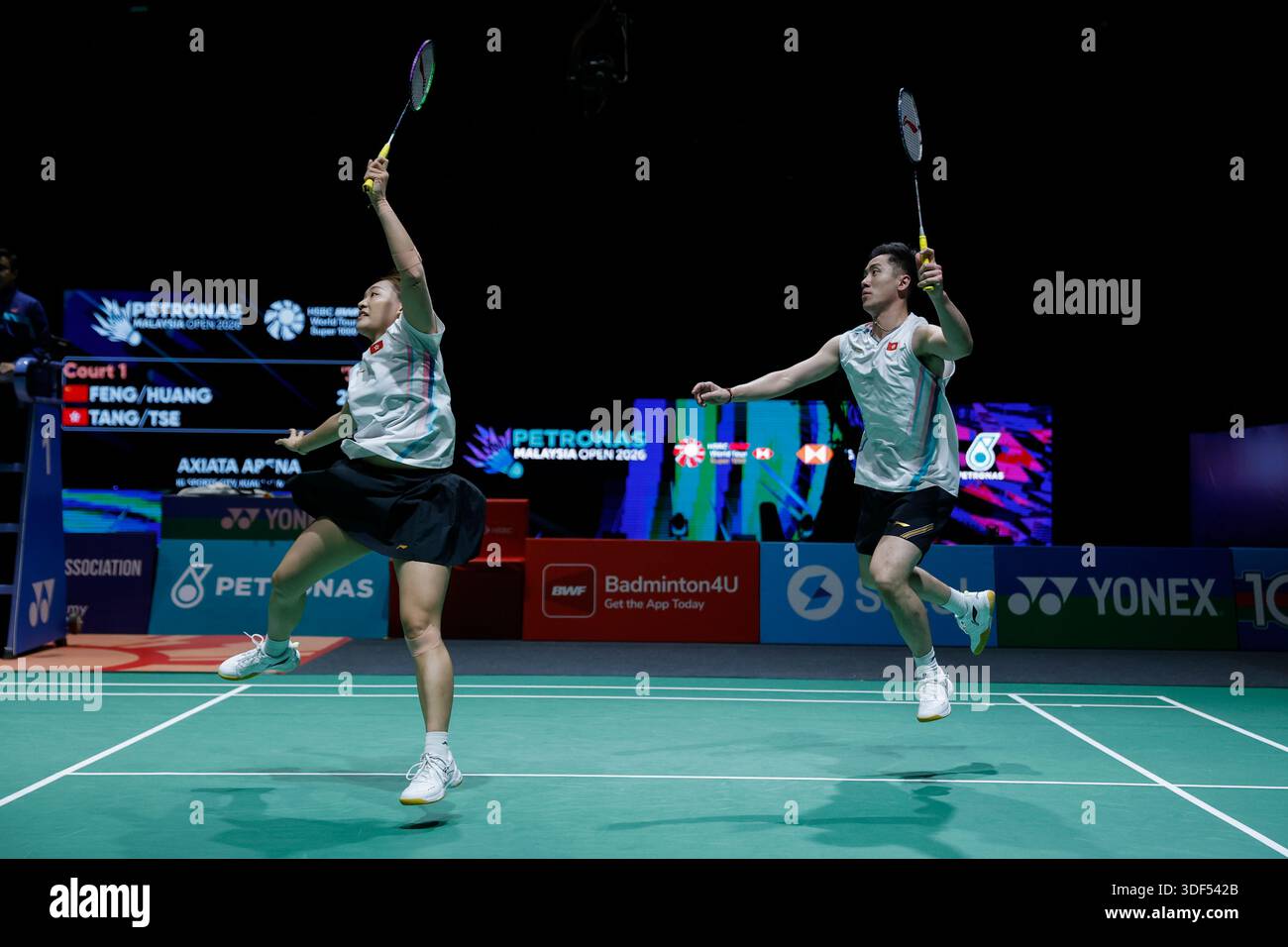 Tang Chun Man (R) and Tse Ying Suet of Hong Kong play against Feng Yan ...