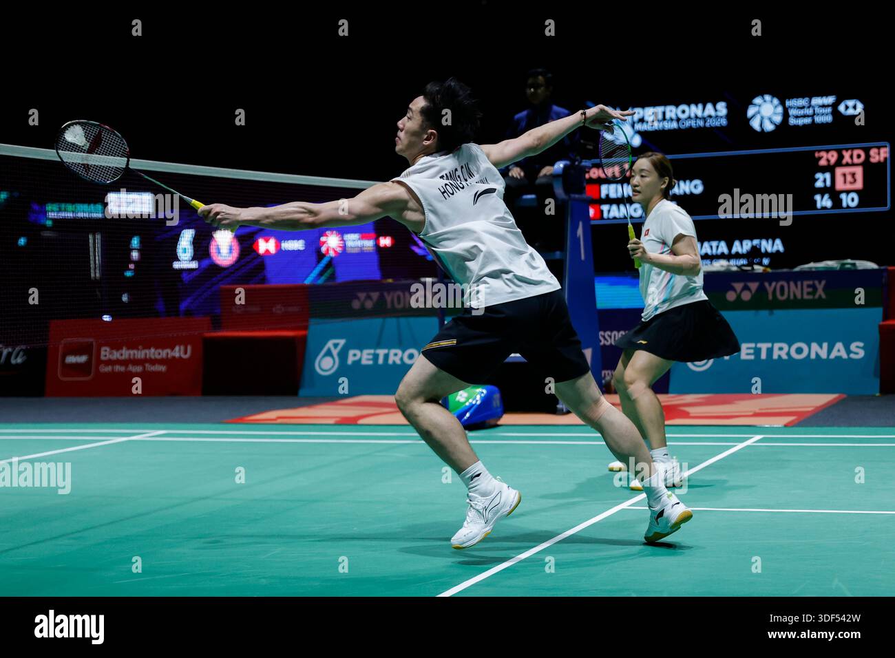 Tang Chun Man (L) and Tse Ying Suet of Hong Kong play against Feng Yan ...