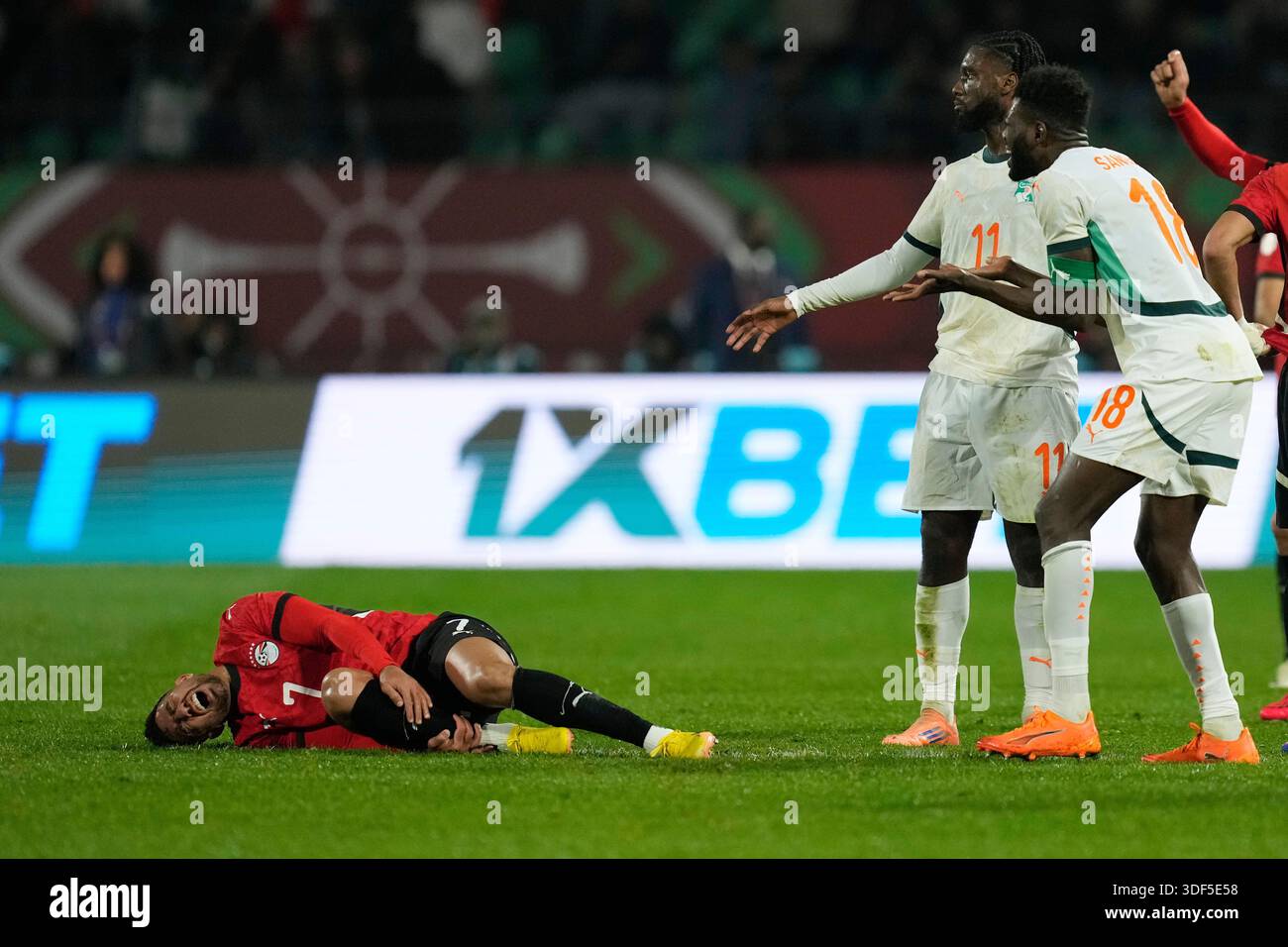 Egypt's Trezeguet grimaces on the ground during the Africa Cup of ...