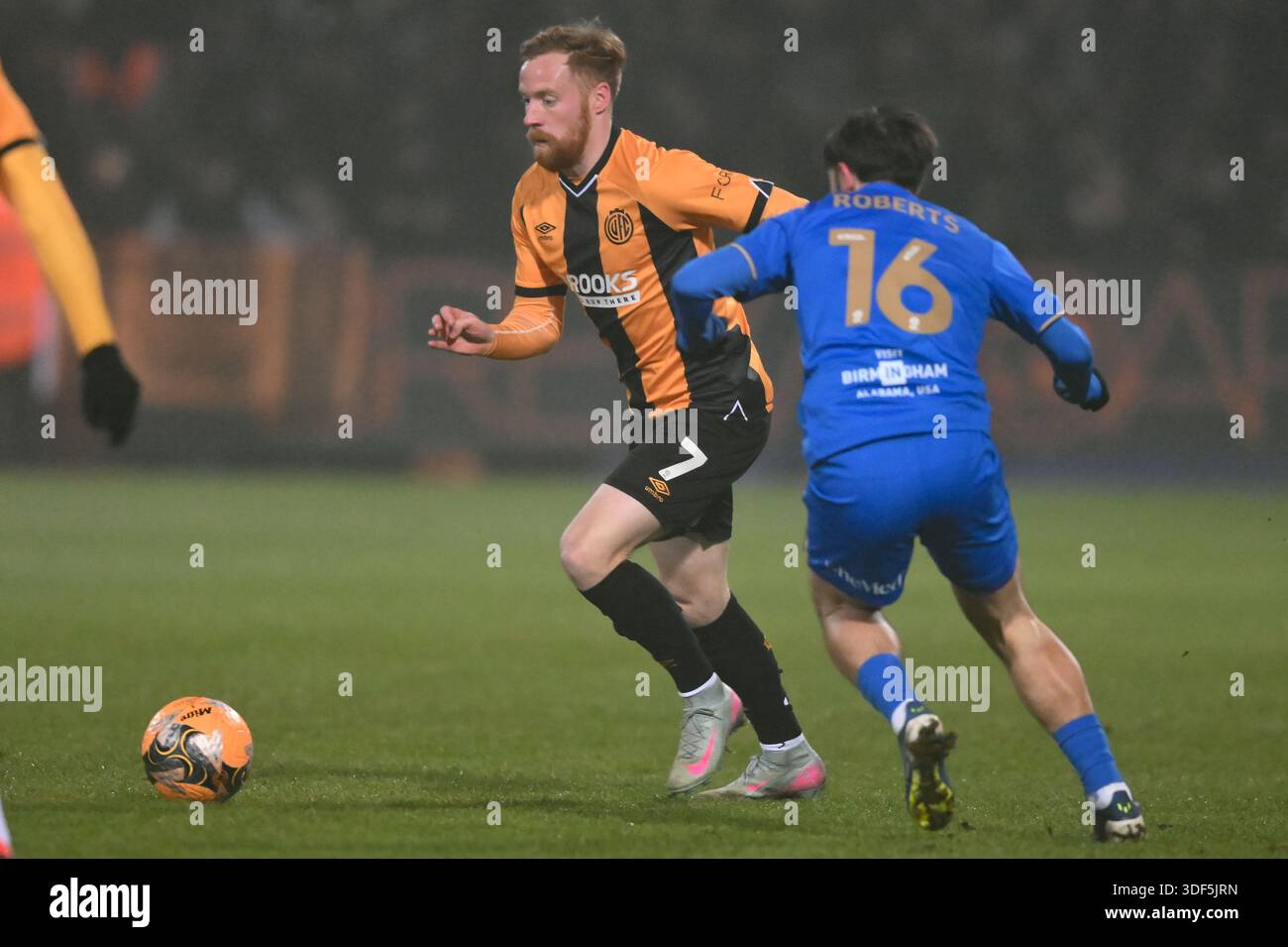 James Brophy of Cambridge United challenged by Patrick Roberts of ...