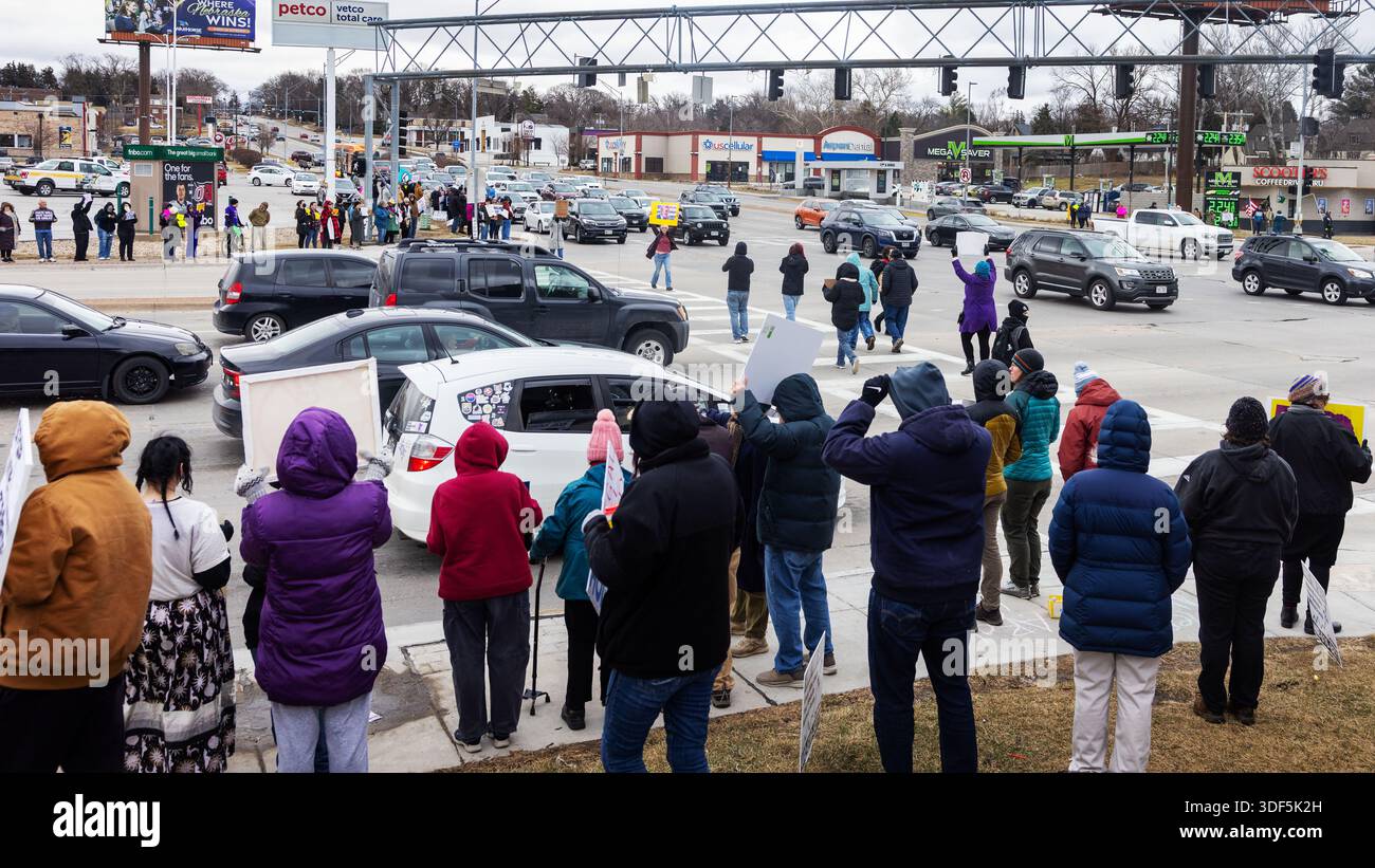 People gather on all four corners for a protest against Immigration and ...