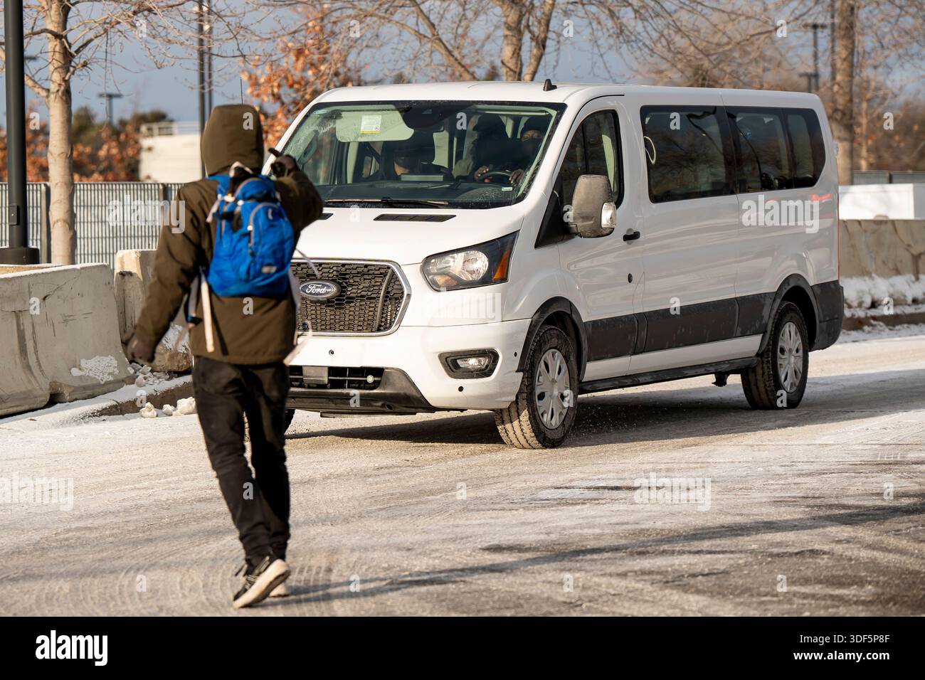 A protestor gestures at Federal agents as they leave the Bishop Henry ...