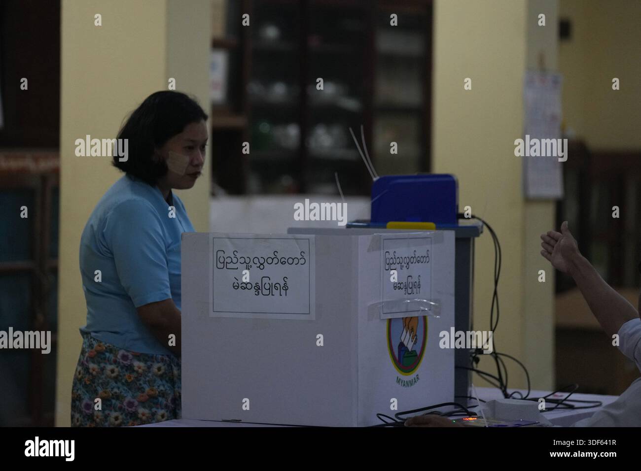 A voter casts ballot at a polling station during the second phase of ...