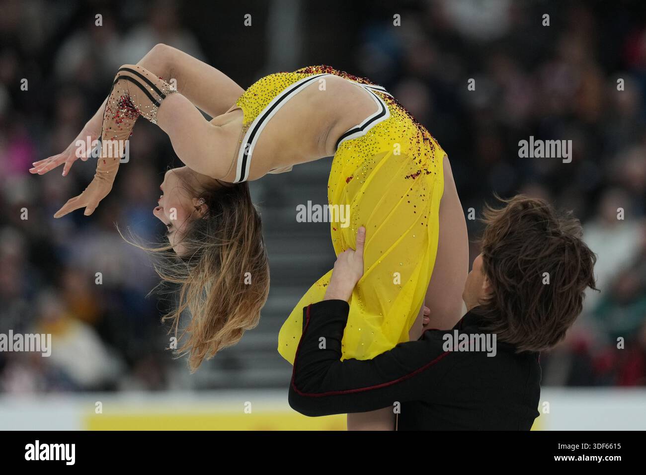 Katarina Wolfkostin and Dimitry Tsarevski skate during the free dance ...