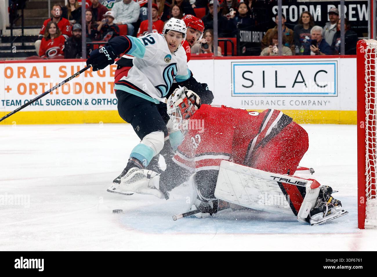 Seattle Kraken's Tye Kartye (12) has his shot frozen by Carolina ...