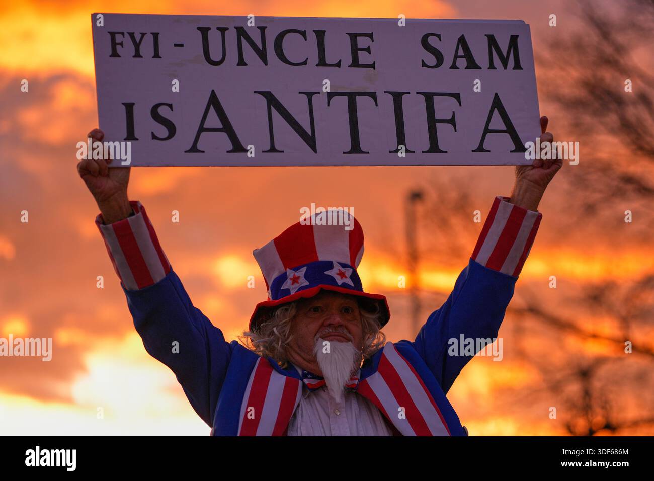 Alan Watkins protests during a rally for Renee Good, who was fatally ...