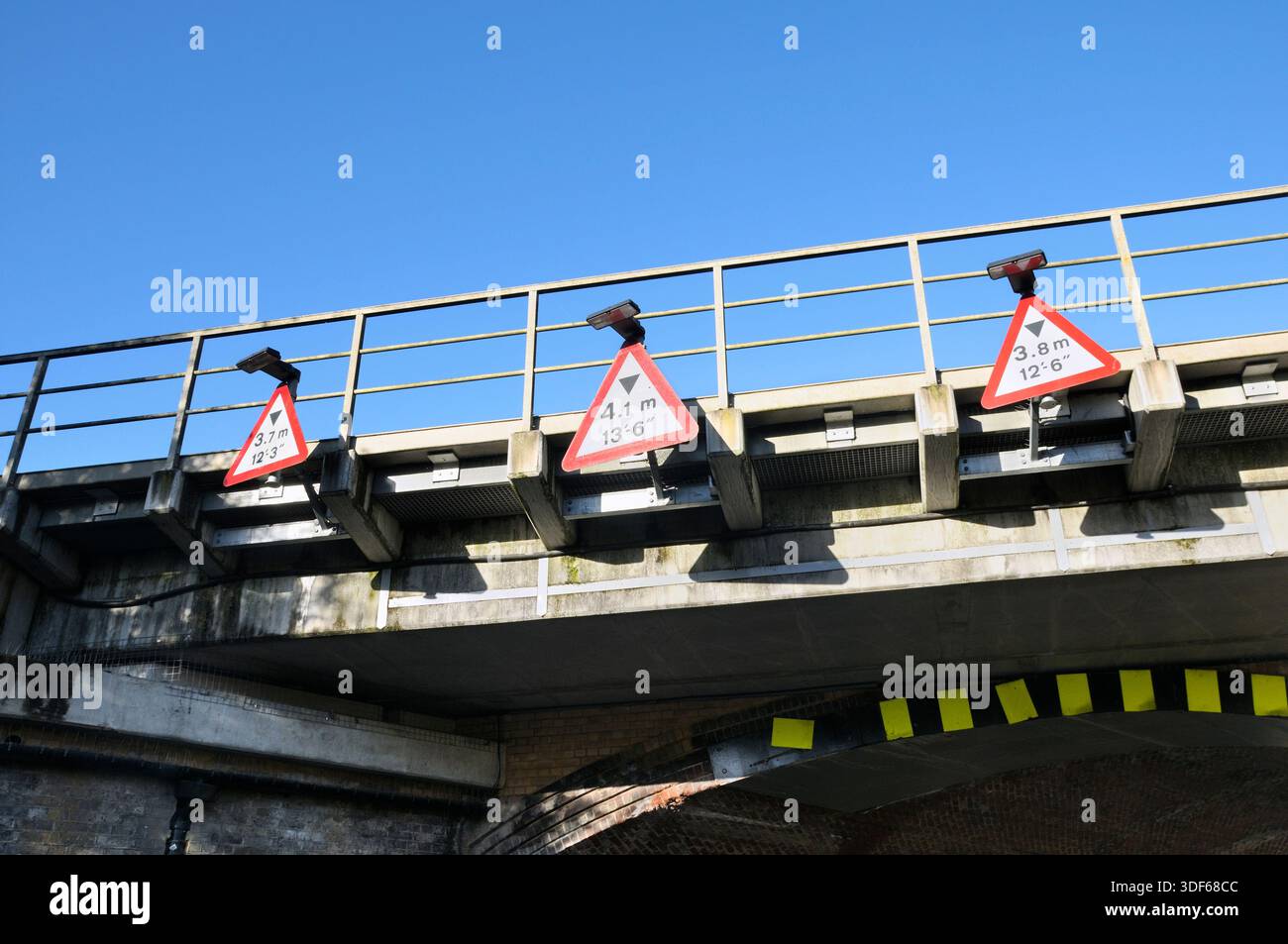 Red triangle warning road signs on bridge tunnel showing height limit ...