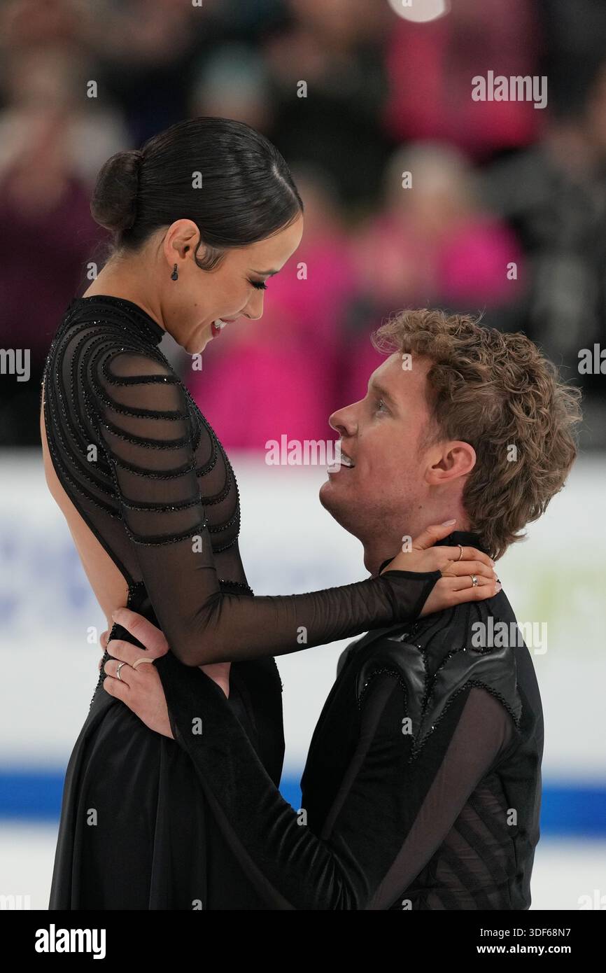 Madison Chock and Evan Bates smile after finishing the free dance ...