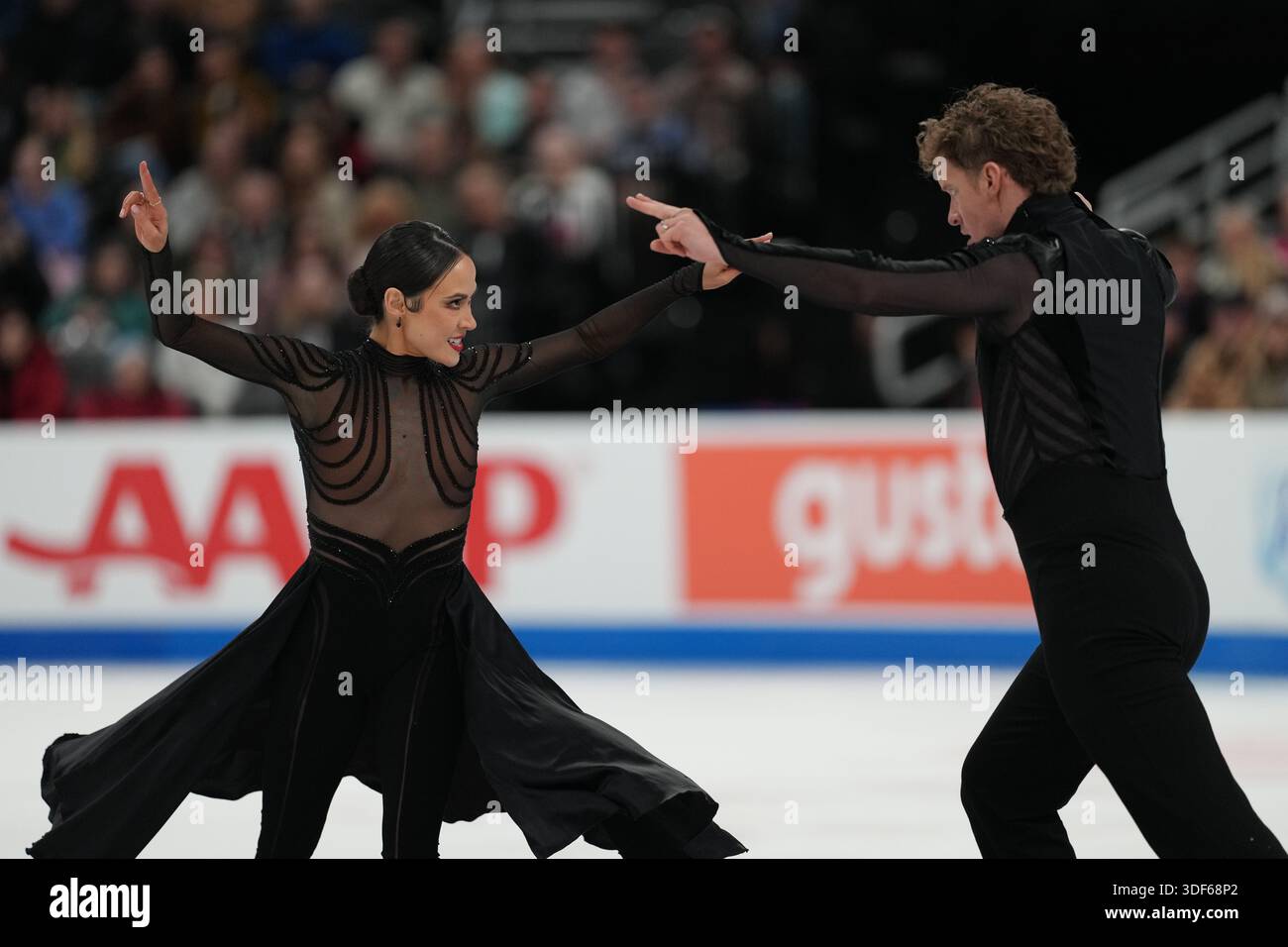 Madison Chock and Evan Bates skate during the free dance competition at ...