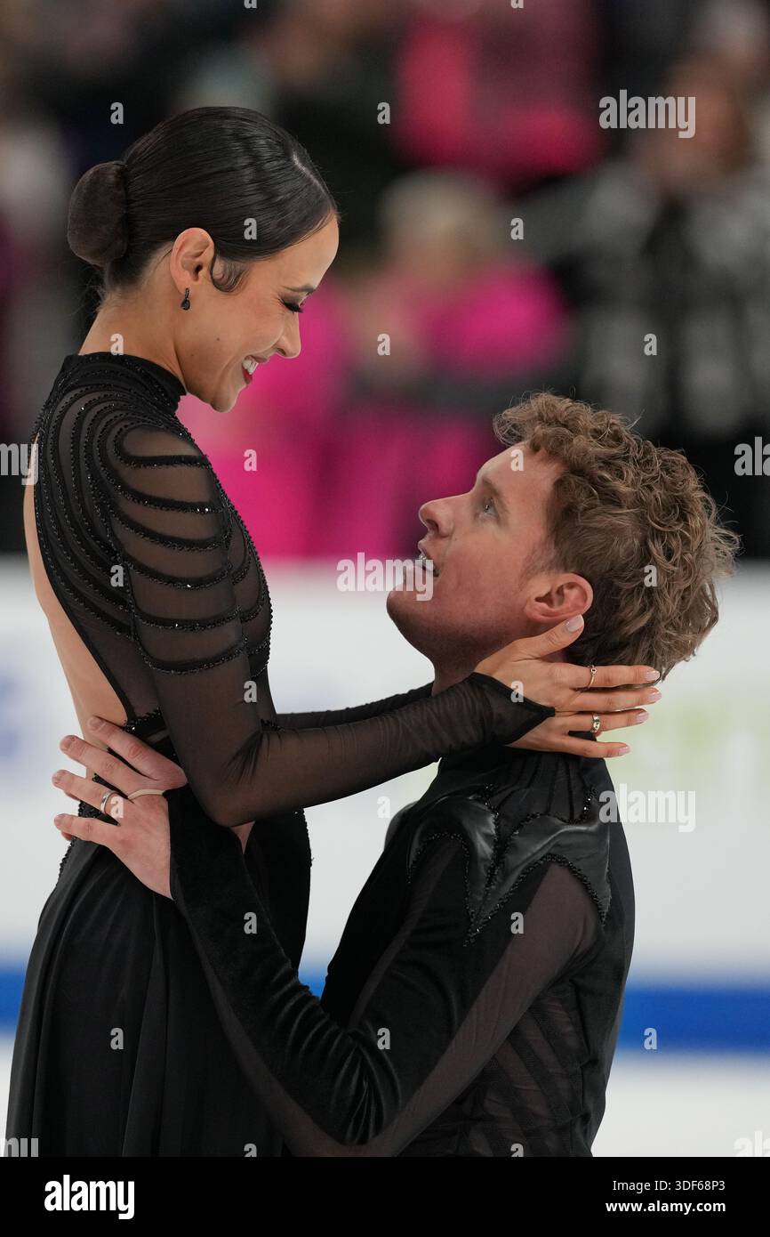 Madison Chock and Evan Bates smile after finishing the free dance ...