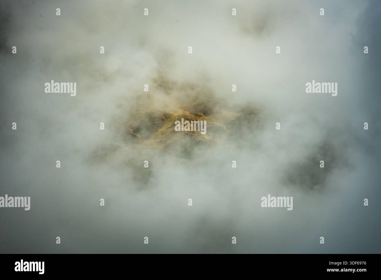 Break In Fog Shows Distant Ski Run in Swiss Mountains Stock Photo - Alamy