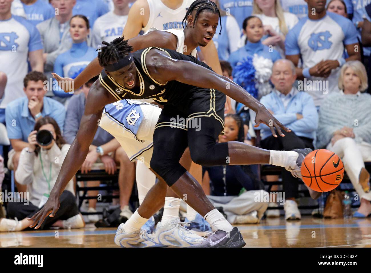 Wake Forest forward Omaha Biliew, front, and North Carolina forward ...