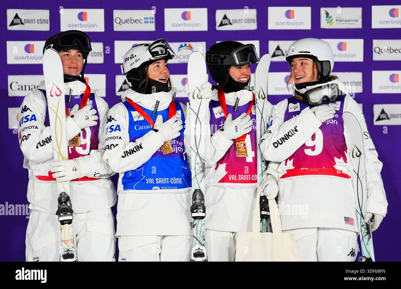 Jaelin Kauf, second from left, of the United States listens to the US ...
