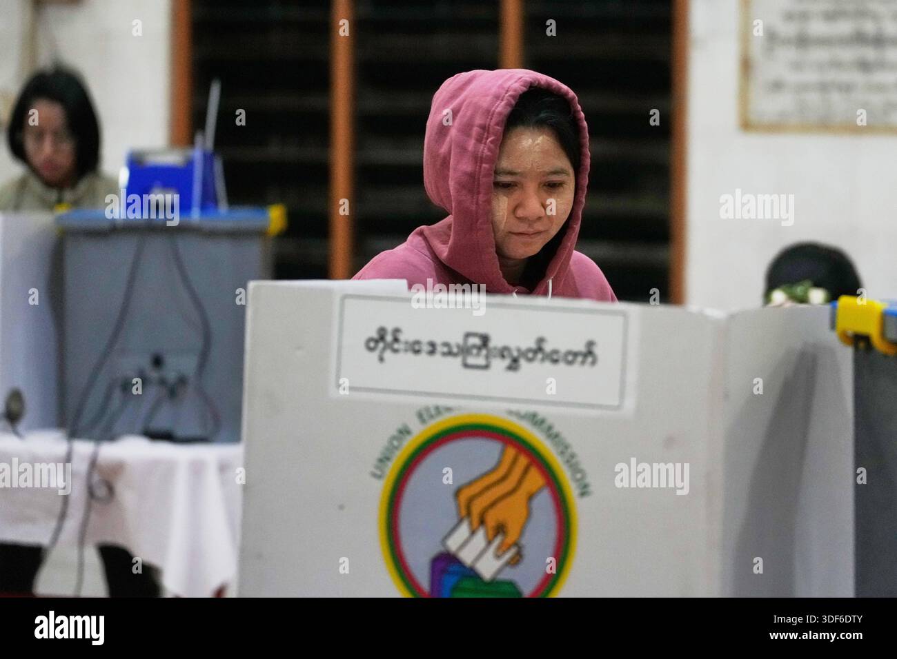 A voter casts ballot at a polling station during the second phase of ...
