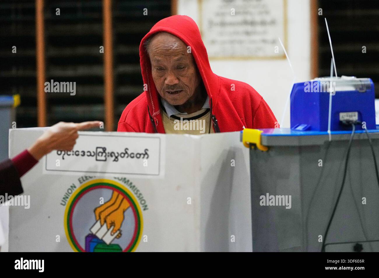 A voter casts ballot at a polling station during the second phase of ...