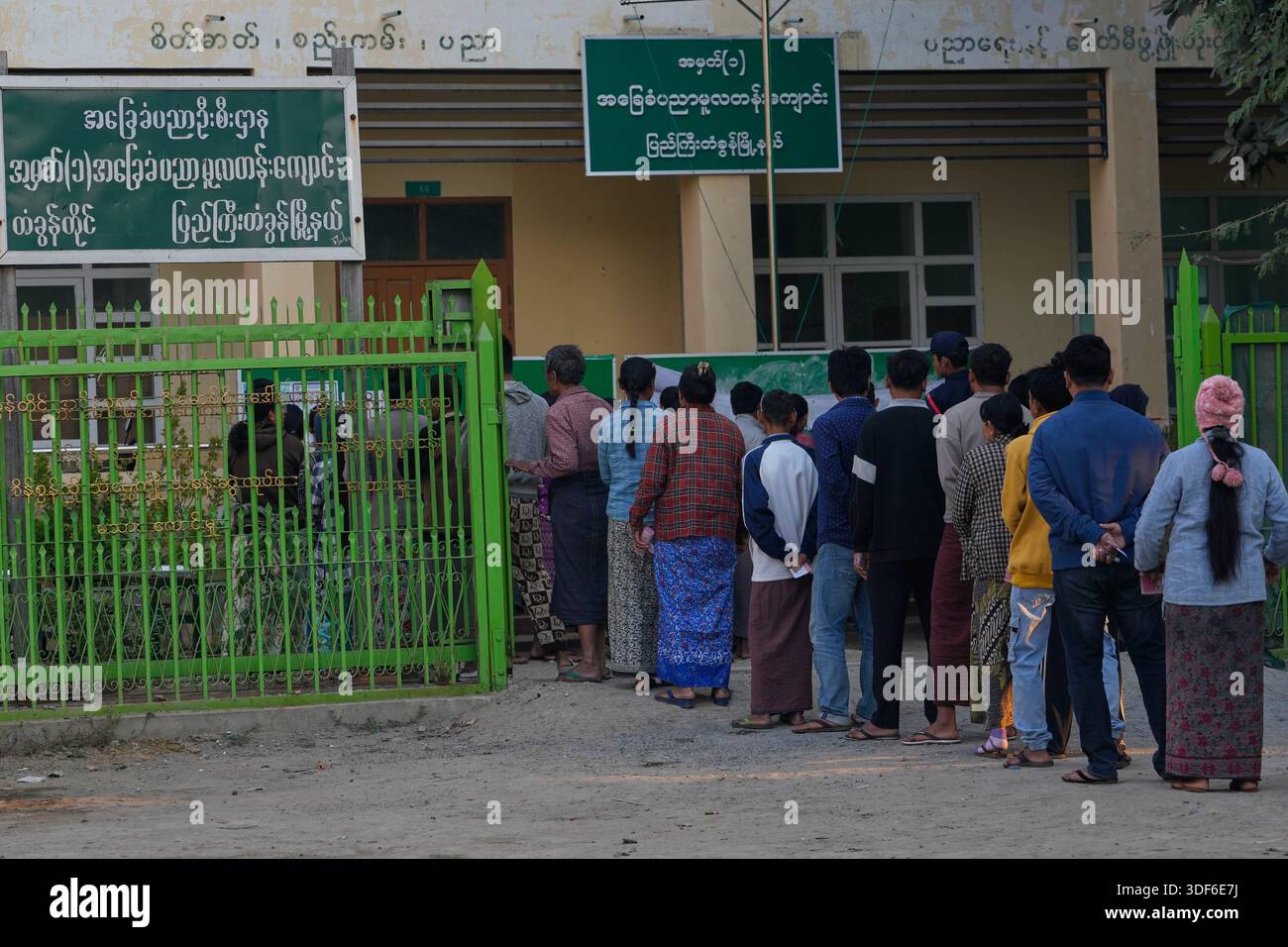 Voters line up to cast their ballots at a polling station during the ...