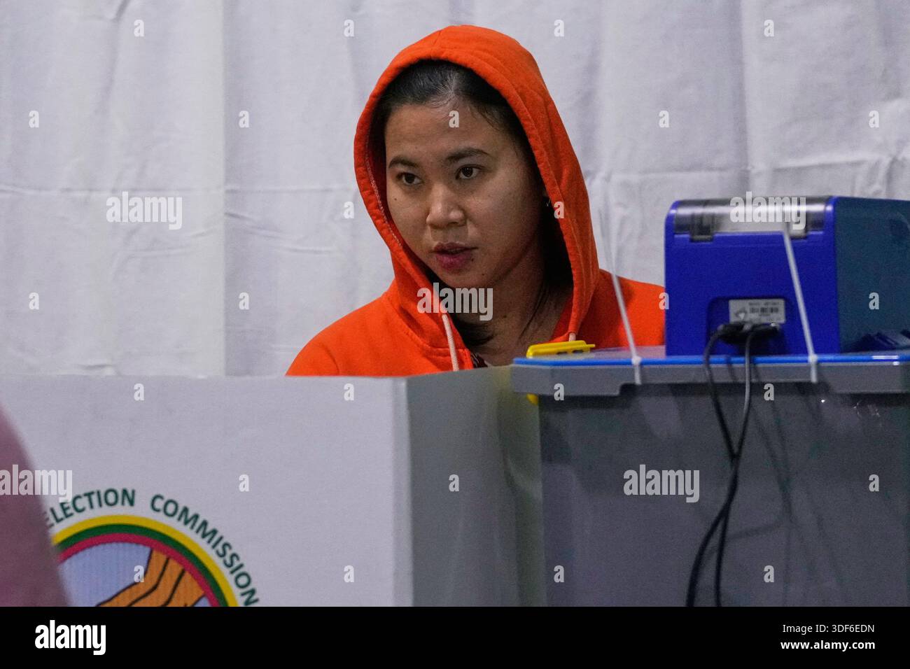 A voter casts ballot at a polling station during the second phase of ...