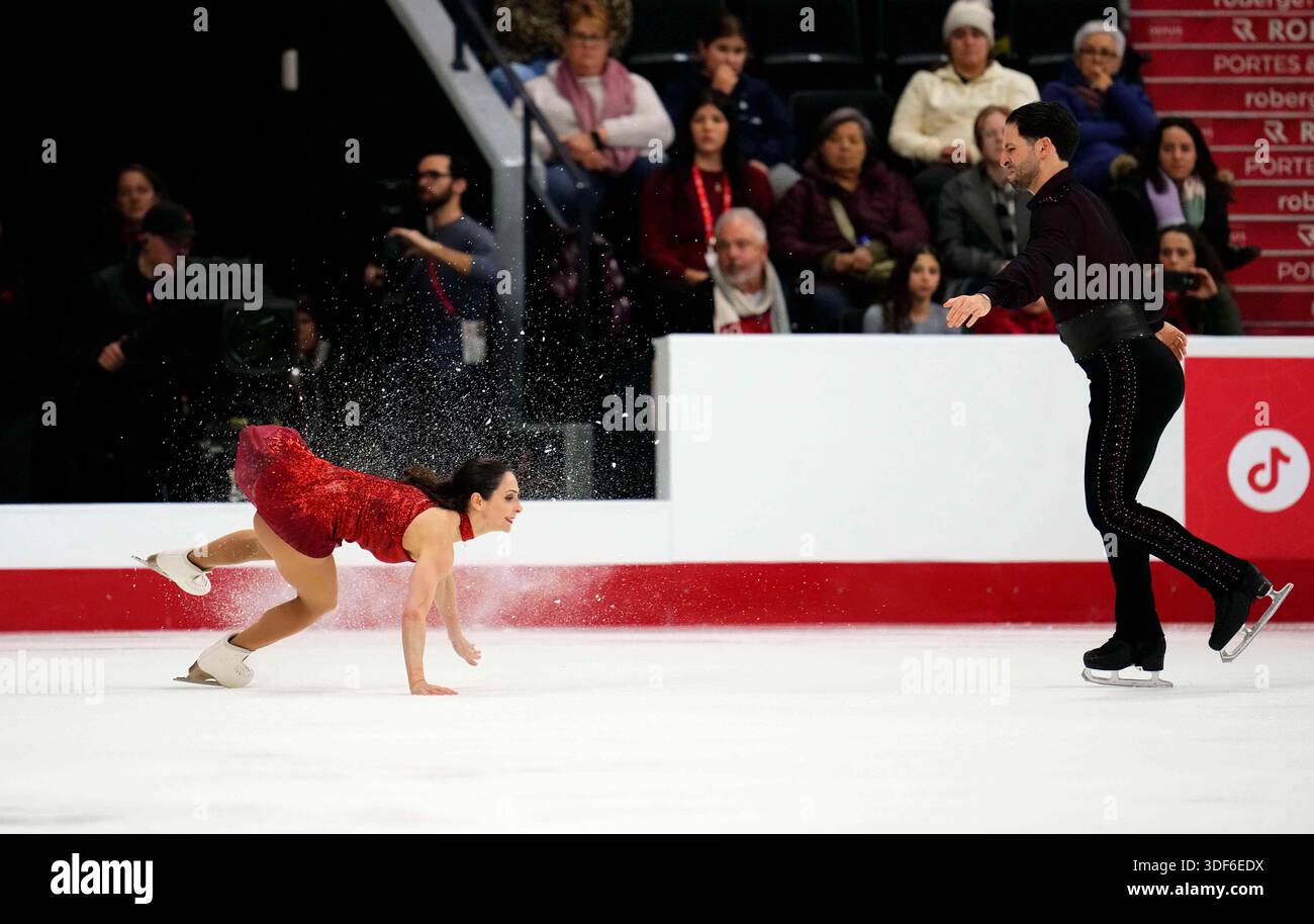 Deanna Stellato-Dudek, left, falls as she and Maxime Deschamps, right ...