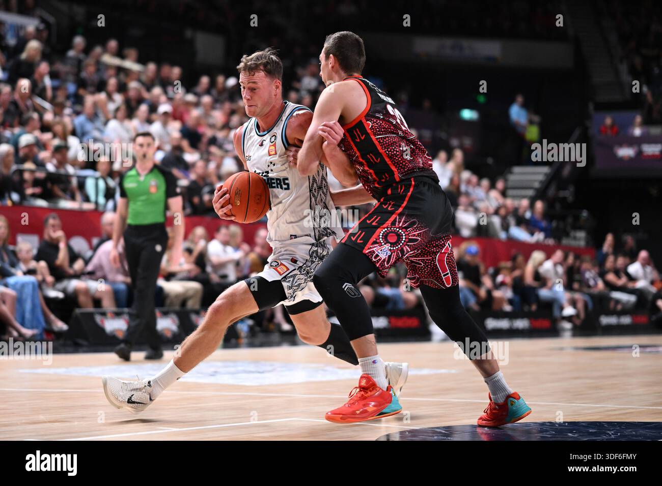 Sam Mennenga of the Breakers and Mason Peatling of the Hawks during the ...