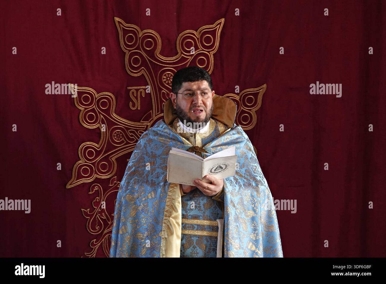Pastor Avedis Tabasyan is seen leading the service at the Surp Giragos ...