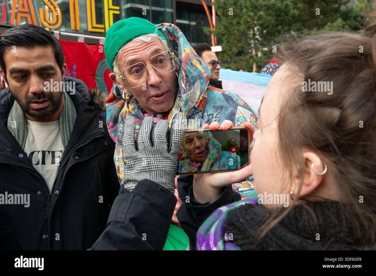 A pro trans protester being interviewed during the demonstration. A ...