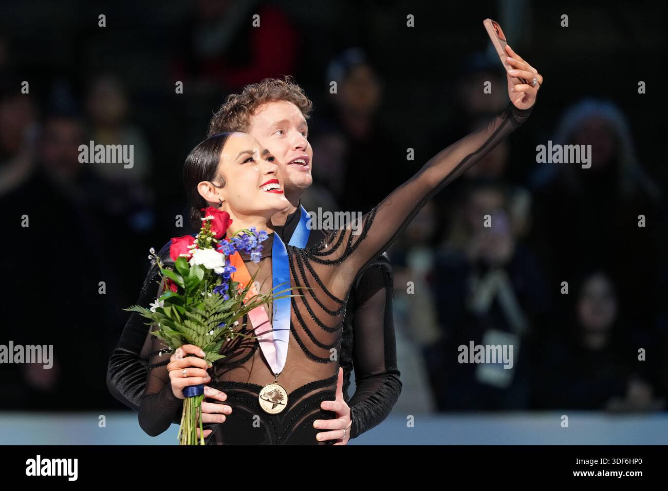 Gold medalists Madison Chock and Evan Bates take a selfie after the ...
