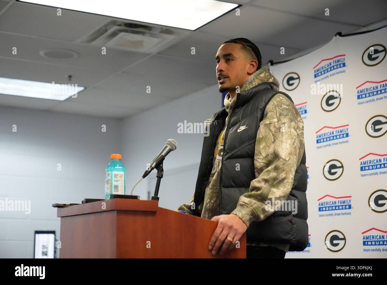 Green Bay Packers' Jordan Love talks after an NFL wild-card playoff ...
