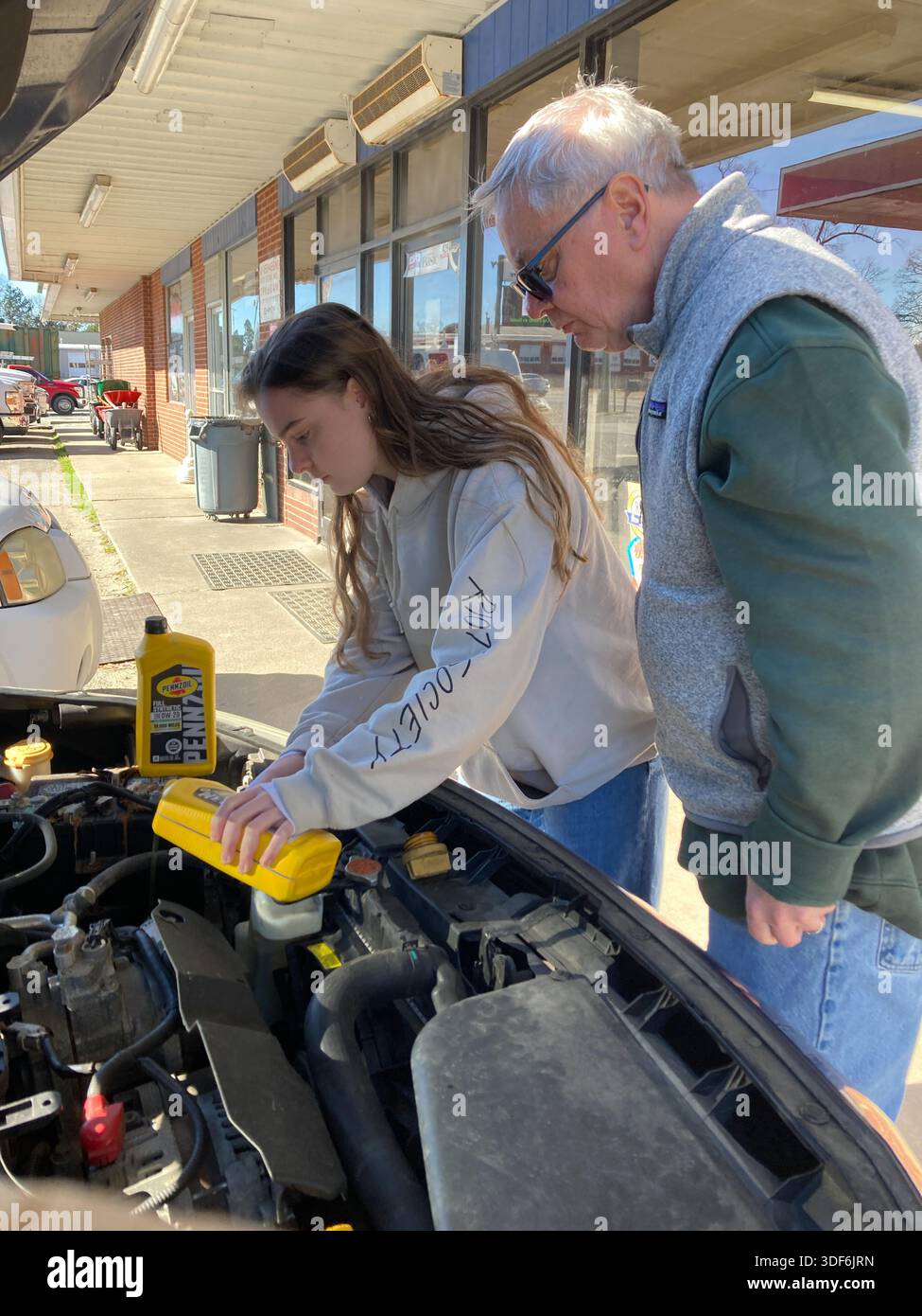 Father and daughter teaching moment - dad shows his daughter how to ...