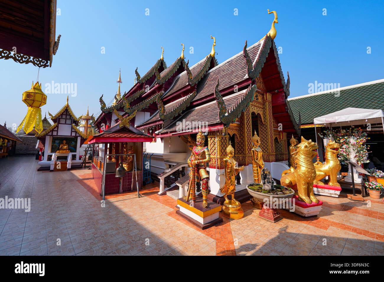 Traditional Lanna architecture and sacred statues at Wat Phra That Doi ...