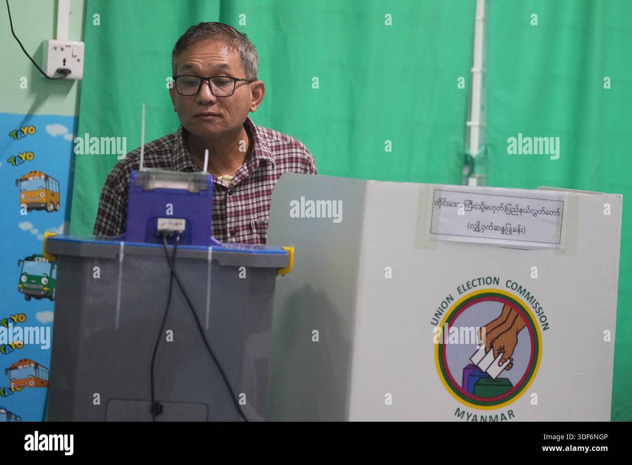 A voter casts ballot at a polling station during the second phase of ...