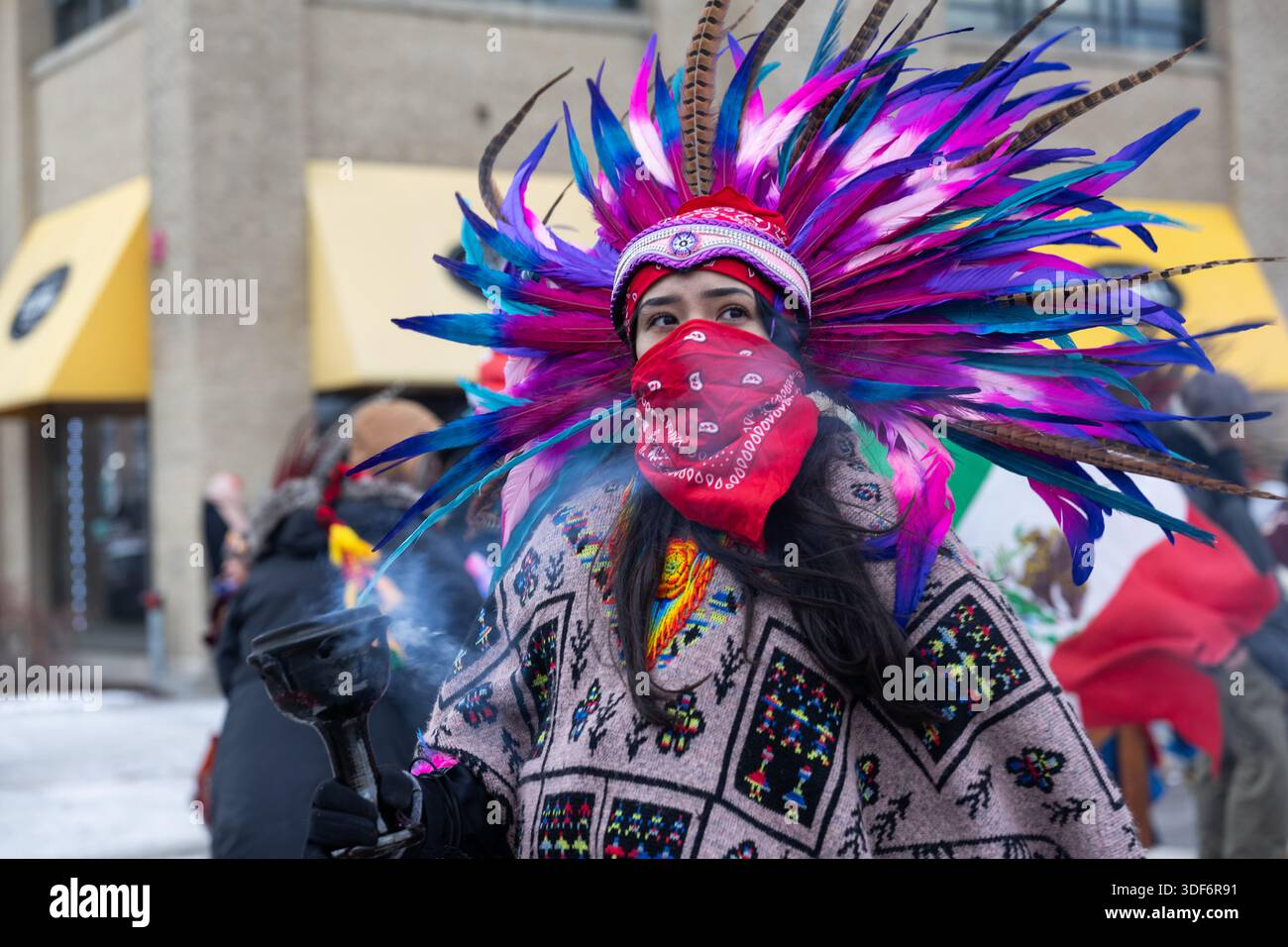 Minnesota Native American performer looks onward during Anti-ICE ...
