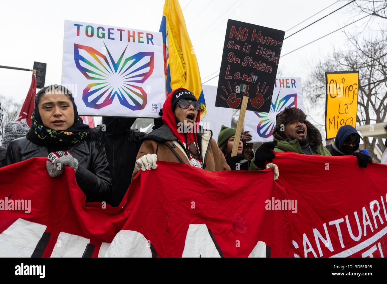 Minnesota protesters cheer in the front of the line during Anti-ICE ...