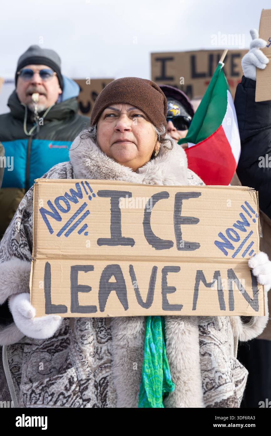 Minnesota Resident holds up sign before Anti-ICE protest for Renee Good ...