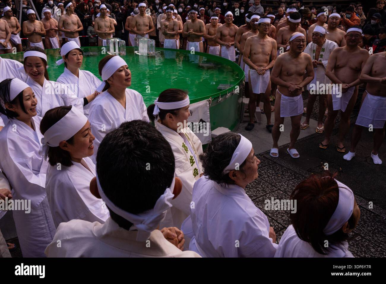 Participants prepare to bath in ice-cold water to purify their souls ...