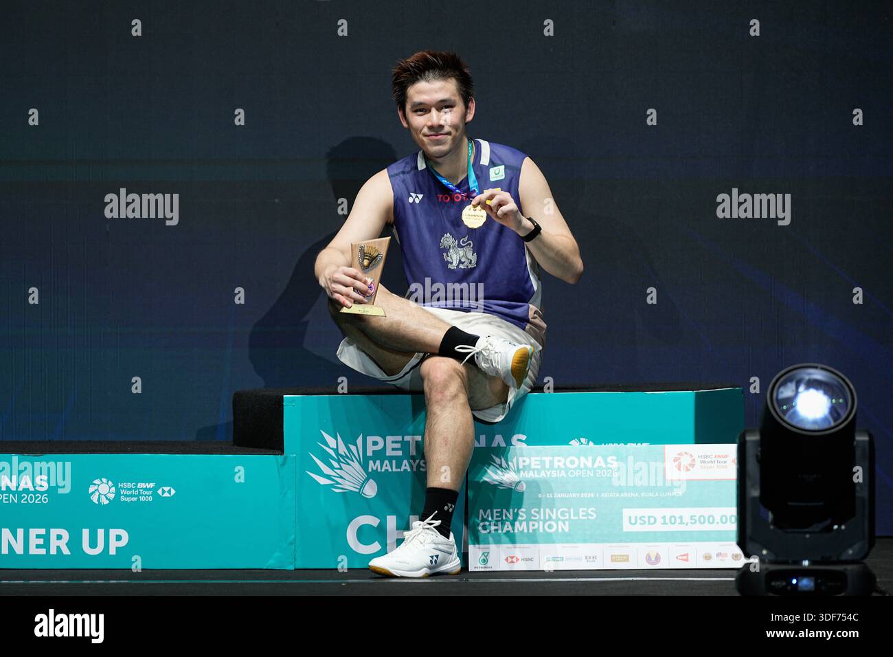 Thailand's Kunlavut Vitidsarn poses on the podium after winning against ...