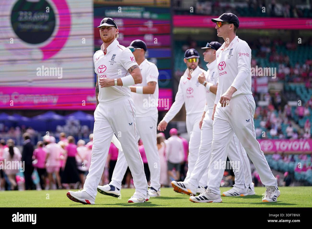 England's Ben Stokes (left) prepares to lead his side on the field on ...