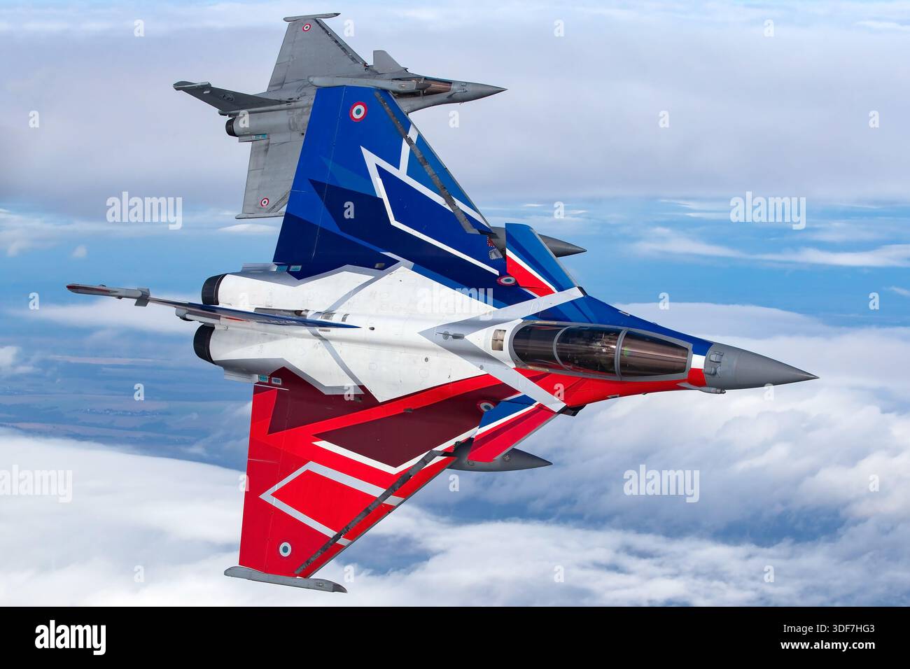 The photograph depicts two French Air Force Dassault Rafale jets ...