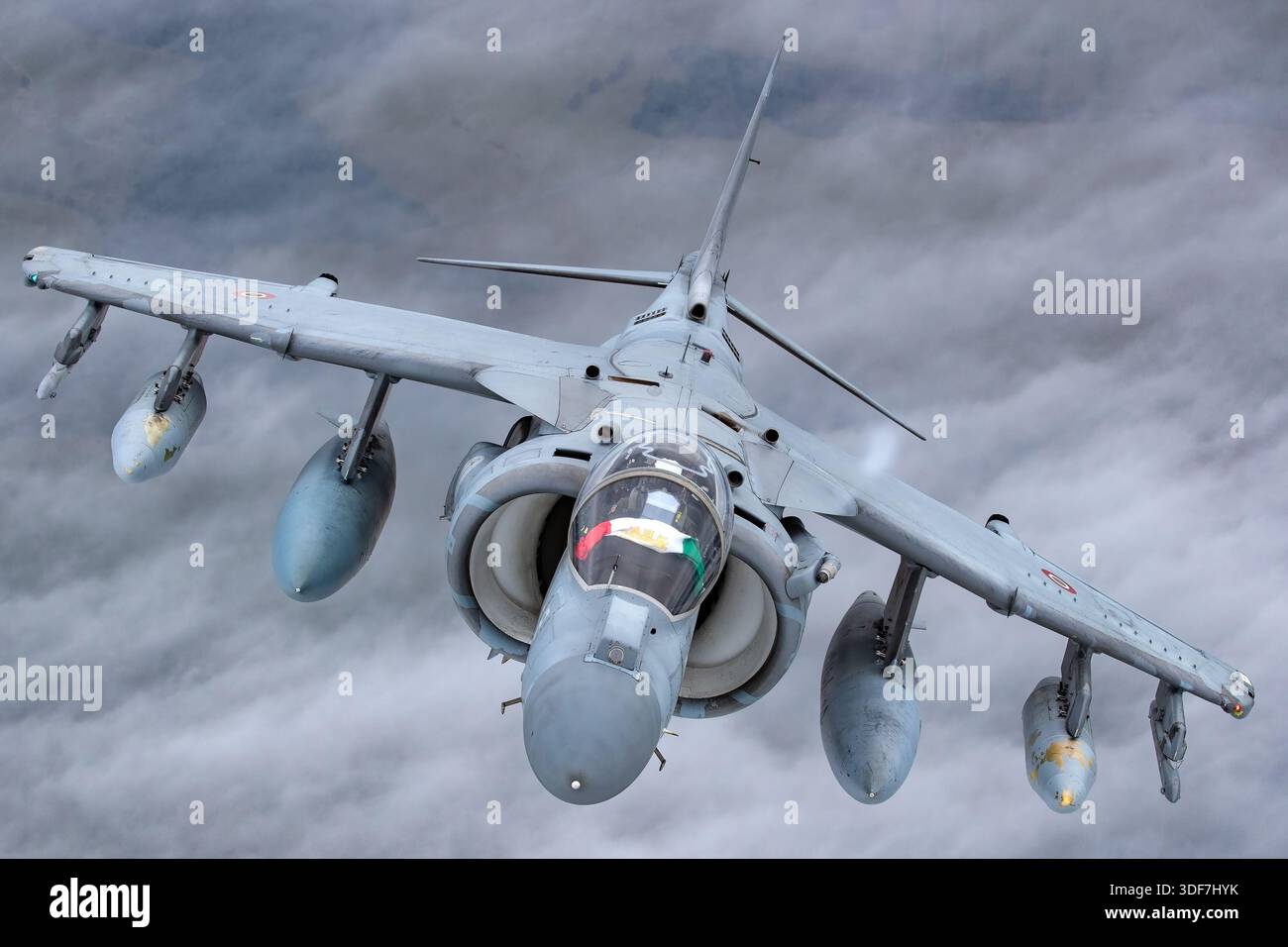 An Italian Navy AV-8B Harrier II is shown in an air-to-air close-up ...