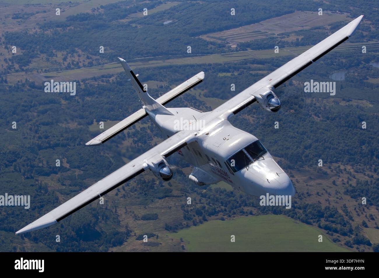 The image shows a Dornier 228-201 turboprop aircraft operated by Summit ...