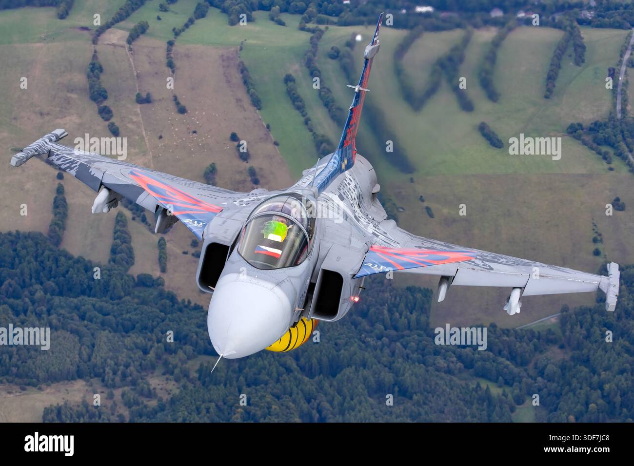 The image presents a close-up air-to-air perspective of a Czech Air ...