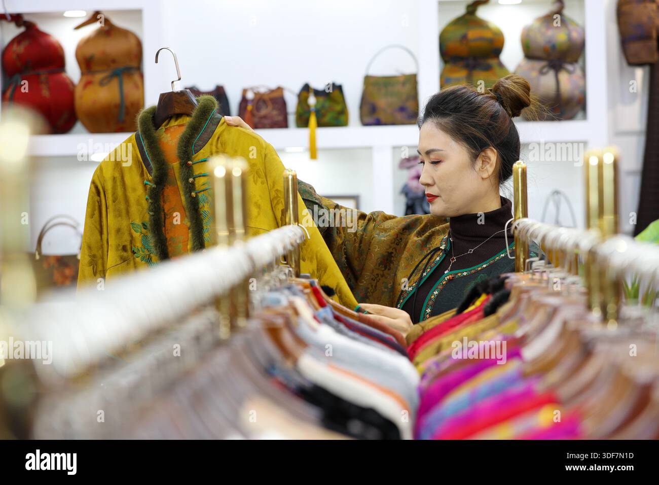 QINGDAO, CHINA - JANUARY 11, 2026 - A consumer is shopping for Chinese ...