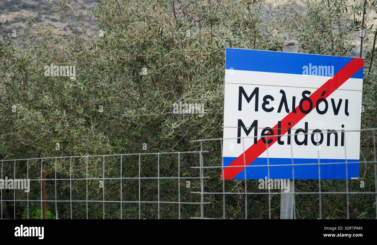 Road sign indicating the end of Melidoni village in Crete, Greece ...
