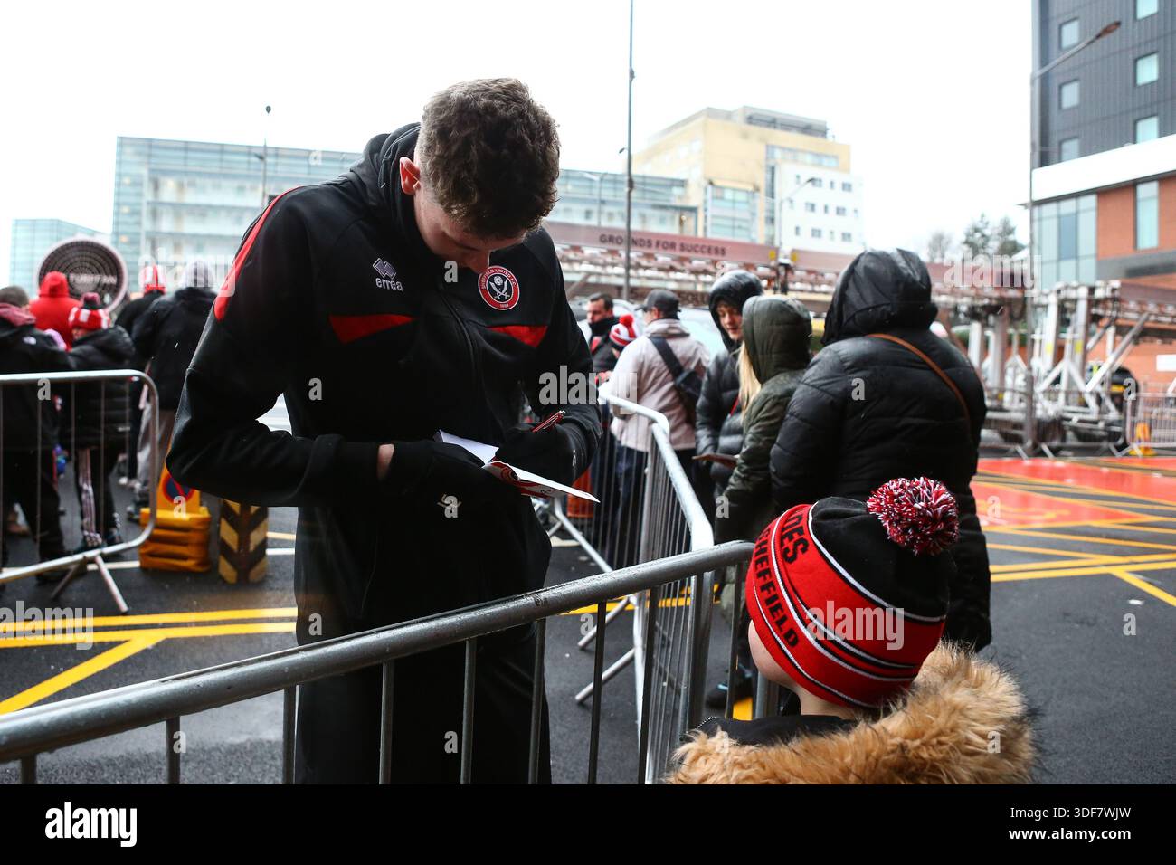 Luke Faxon of Sheffield United signs a fans notebook prior to the ...