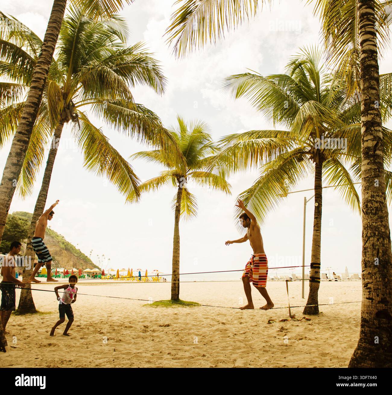 Brazilian locals slacklining, balancing and walking on a suspended ...