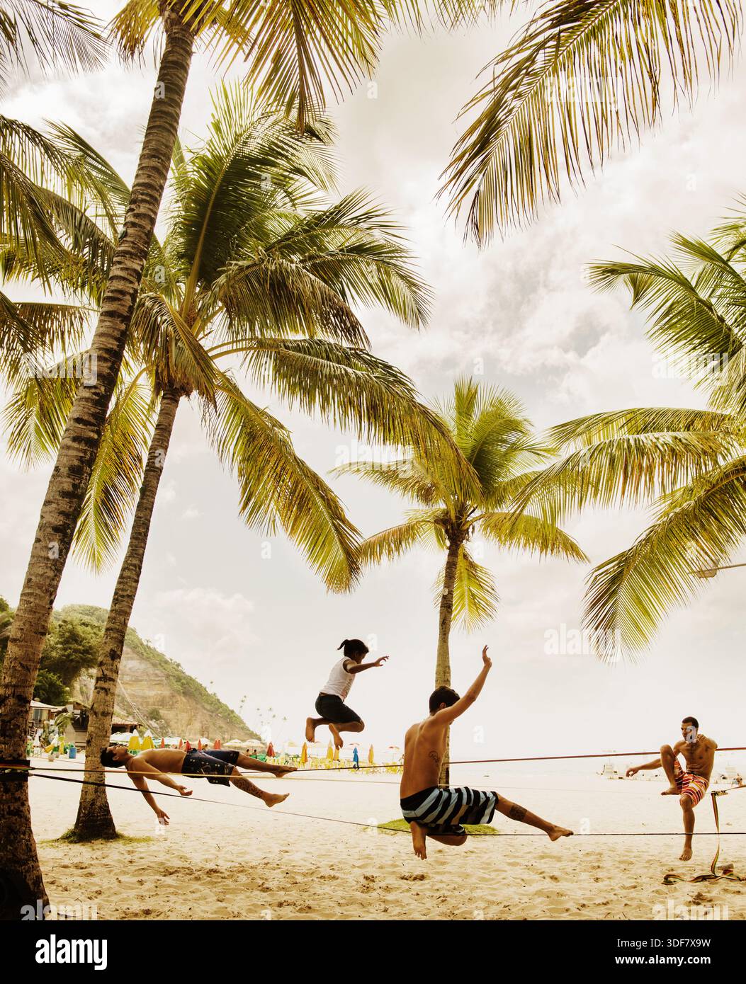Brazilian locals slacklining, balancing and walking on a suspended ...