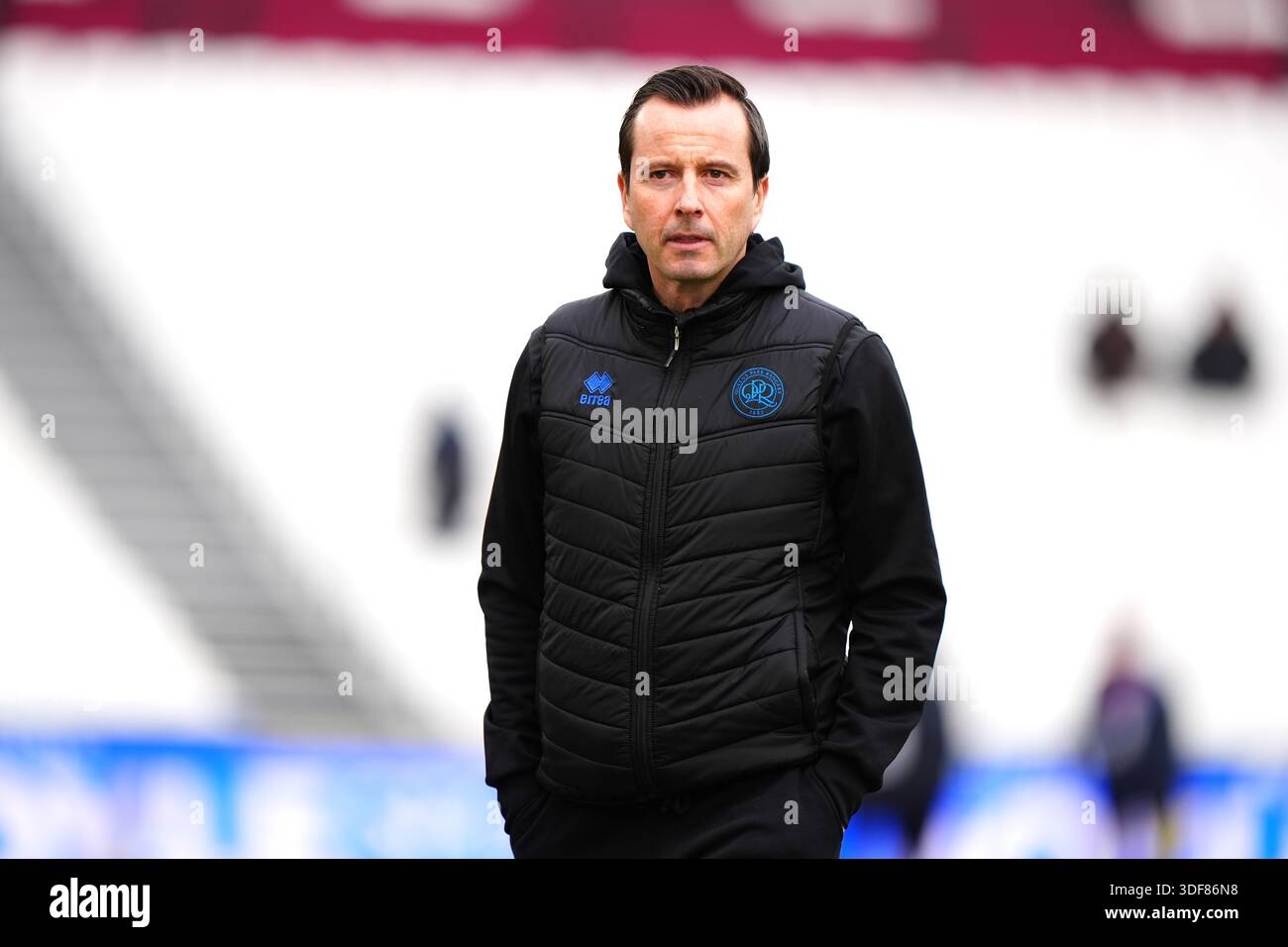 Queens Park Rangers manager Julien Stephan inspects the pitch before ...