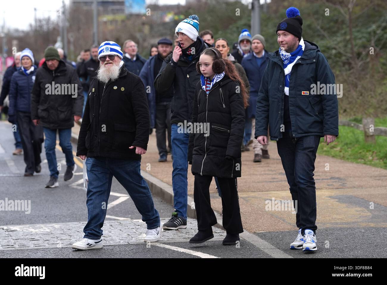 Queens Park Rangers fans make their way to the stadium ahead of the ...